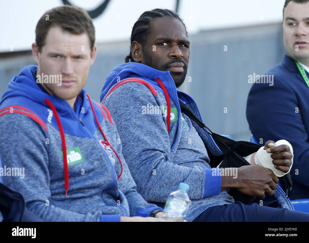 Edrick Lee of the Knights sits on the sideline with a broken arm to ...