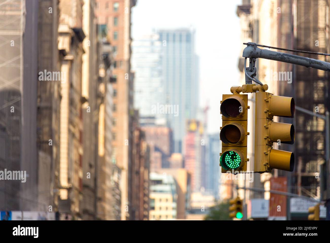 Yellow traffic lights on a street in New York city Stock Photo - Alamy