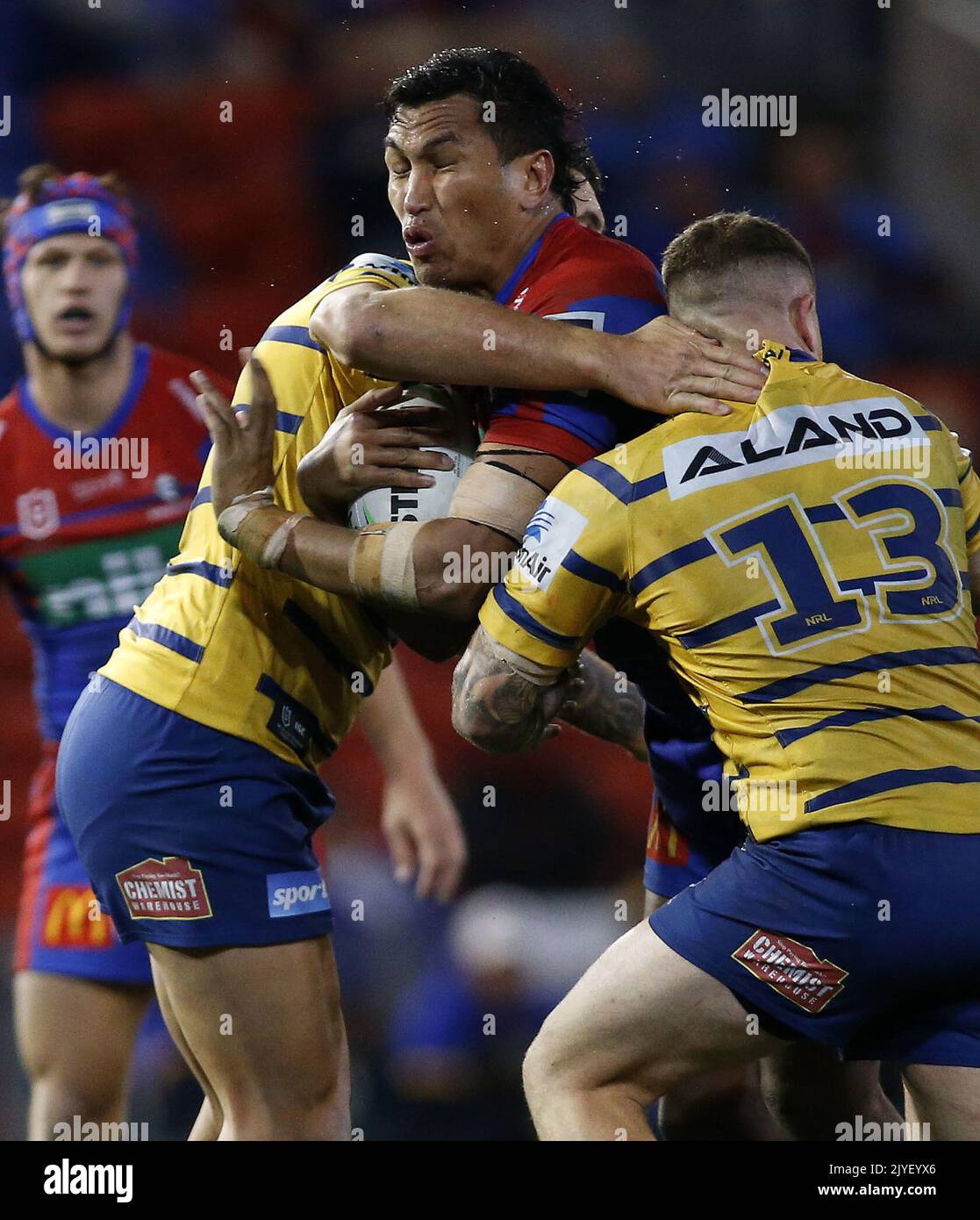 Jacob Saifiti of the Knights is tackled during the Round 9 NRL match ...
