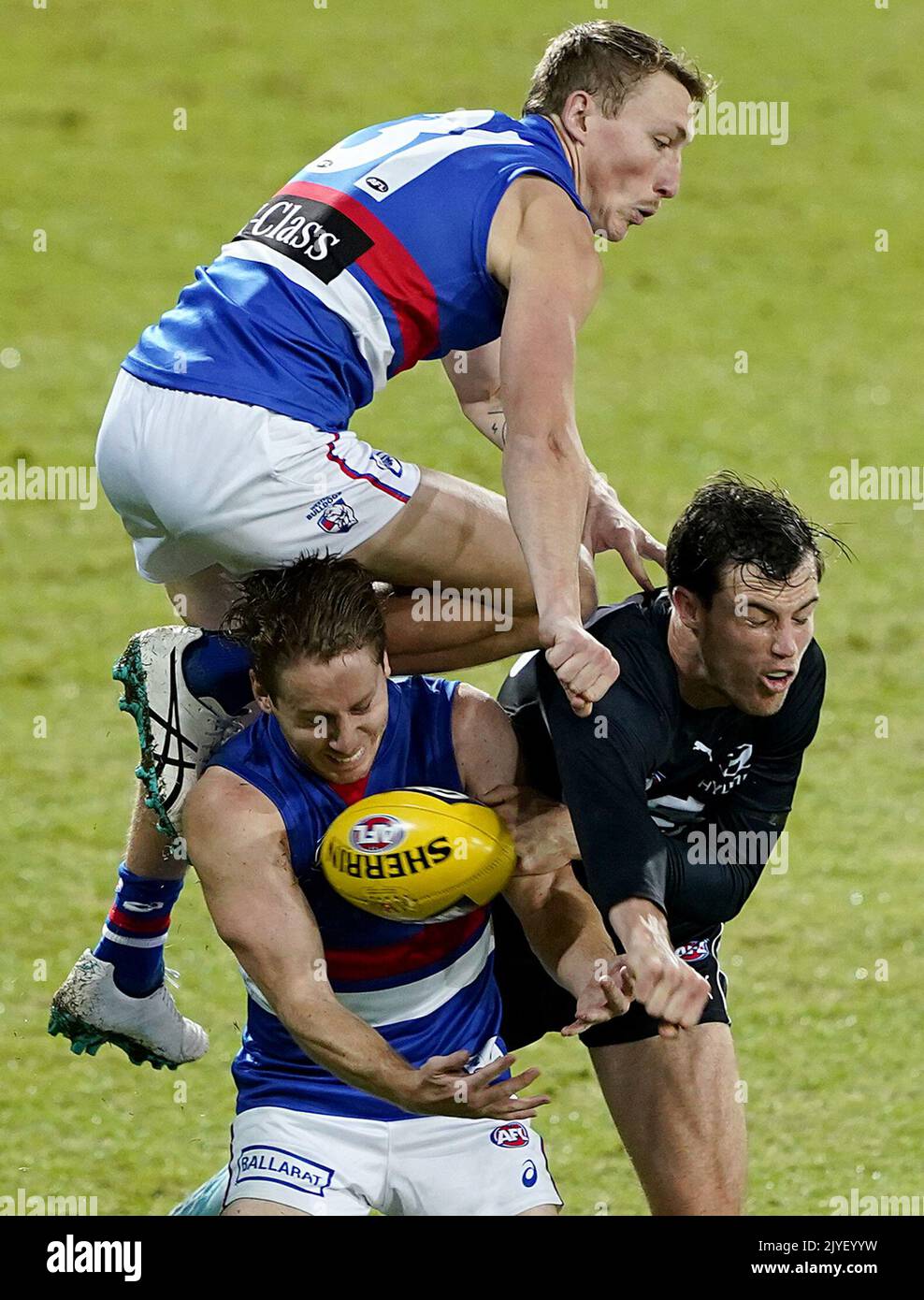 Bailey Dale of the Bulldogs attempts a mark over team mate Lachie ...