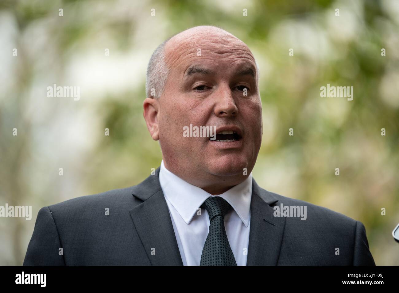 Acting Commissioner Tony Cooke speaking to media at a press conference ...