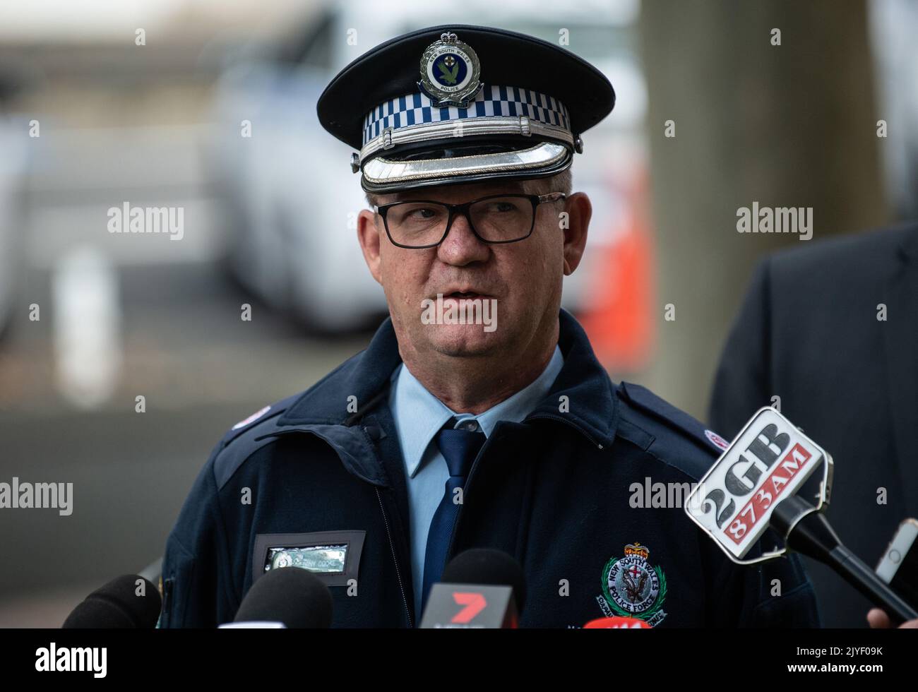 Acting Commissioner Tony Cooke speaking to media at a press conference ...