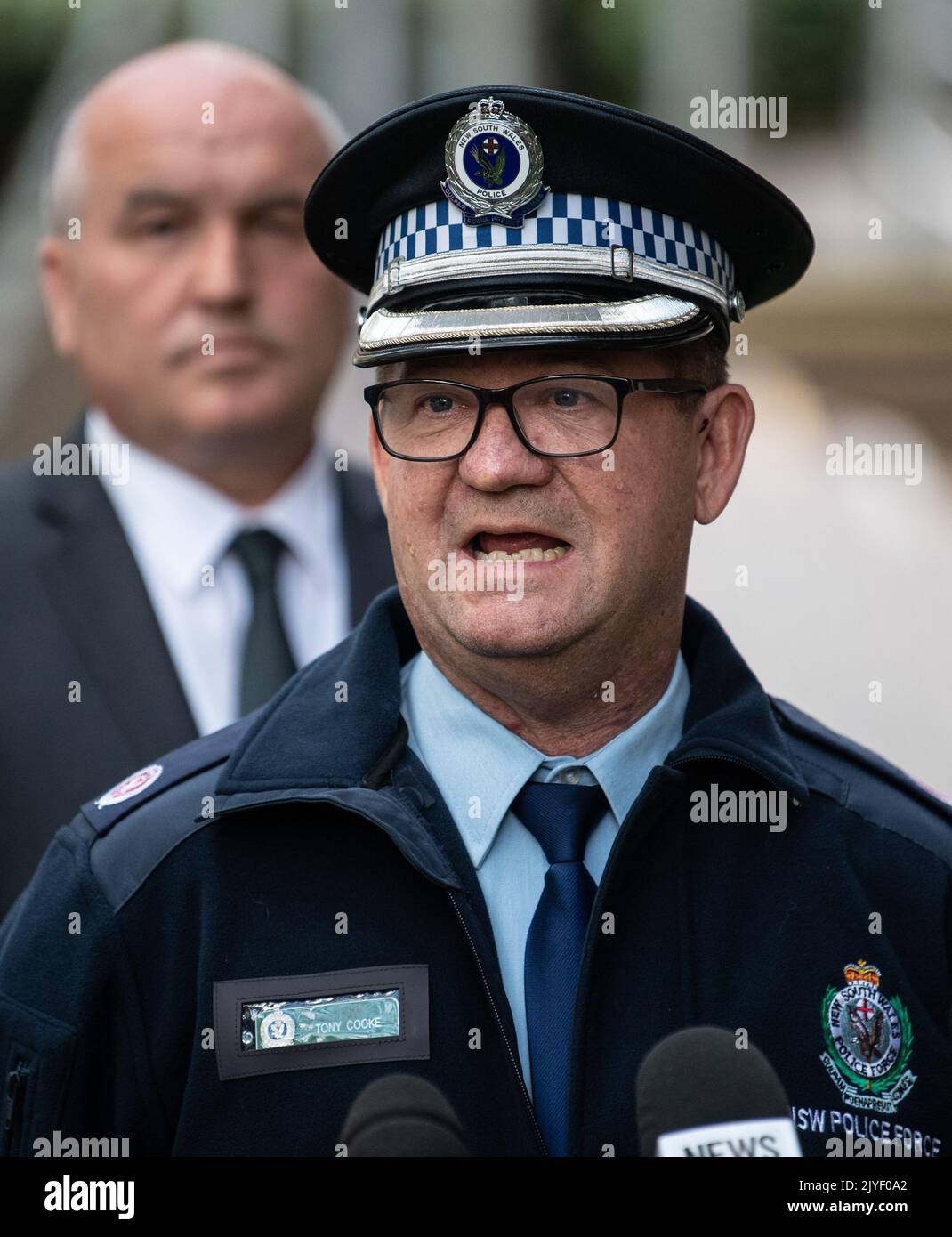 Acting Commissioner Tony Cooke speaking to media at a press conference ...
