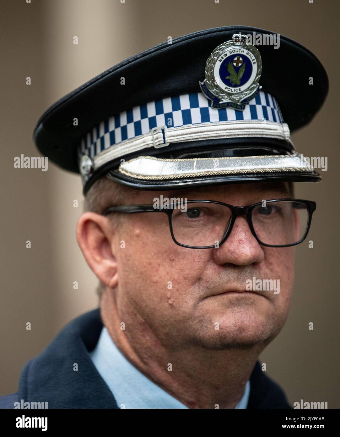 Acting Commissioner Tony Cooke speaking to media at a press conference ...