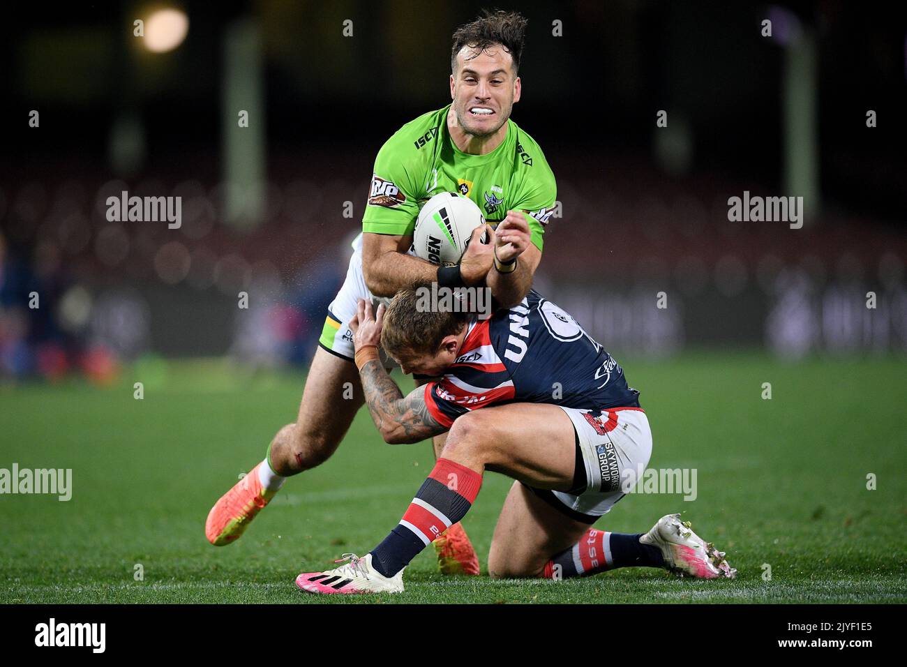 Michael Oldfield of the Raiders is tackled by Jake Friend of the ...