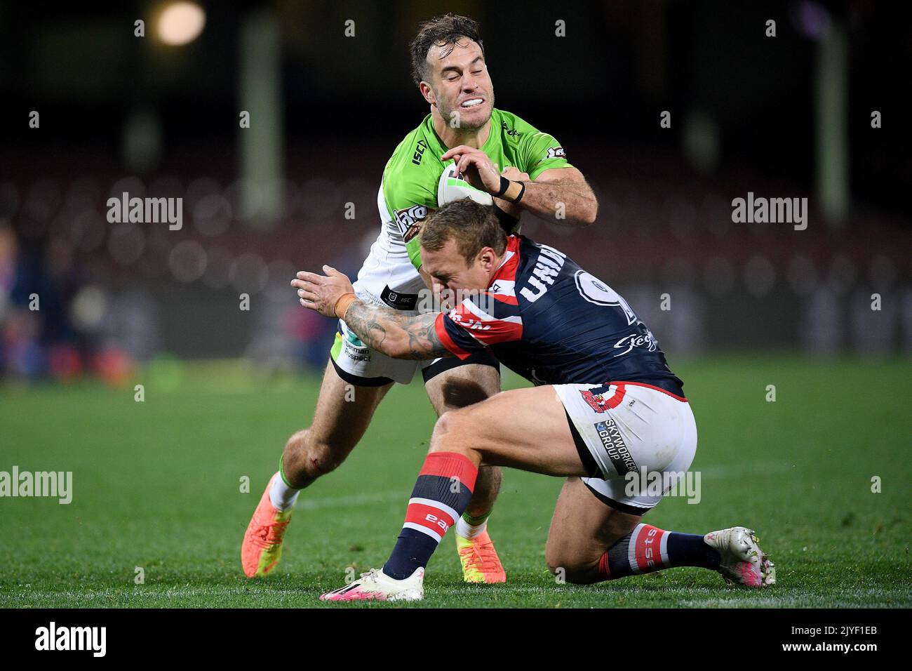 Michael Oldfield of the Raiders is tackled by Jake Friend of the ...