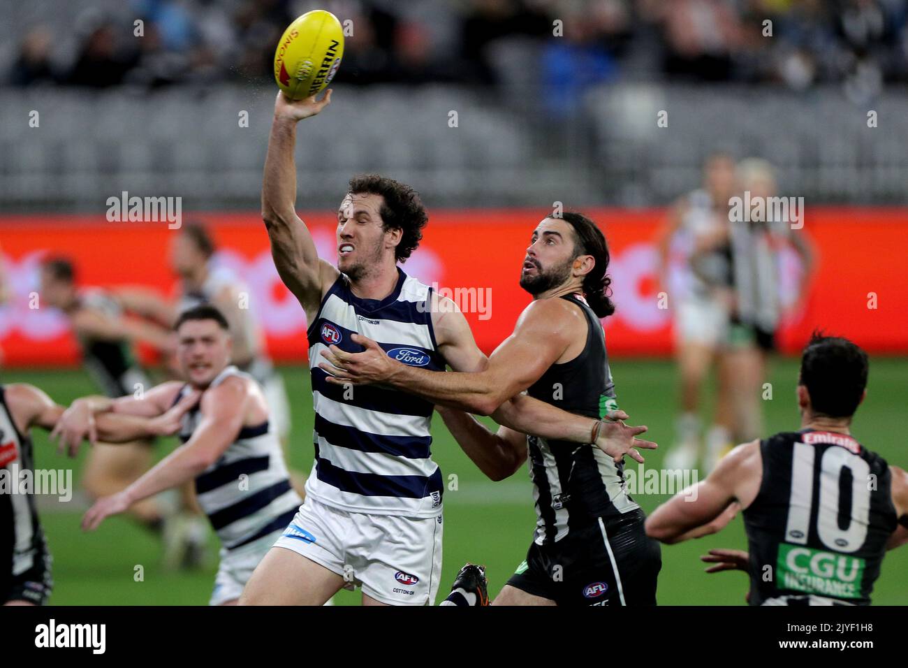 Darcy Fort of the Cats and Brodie Grundy of the Magpies in action ...