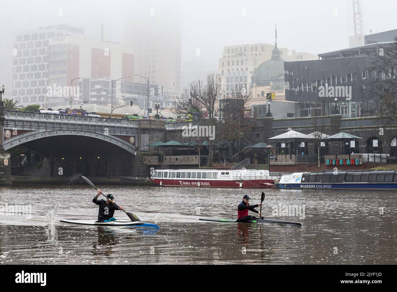 People are seen rowing on the Yarra River in Melbourne, Friday, July 17 ...