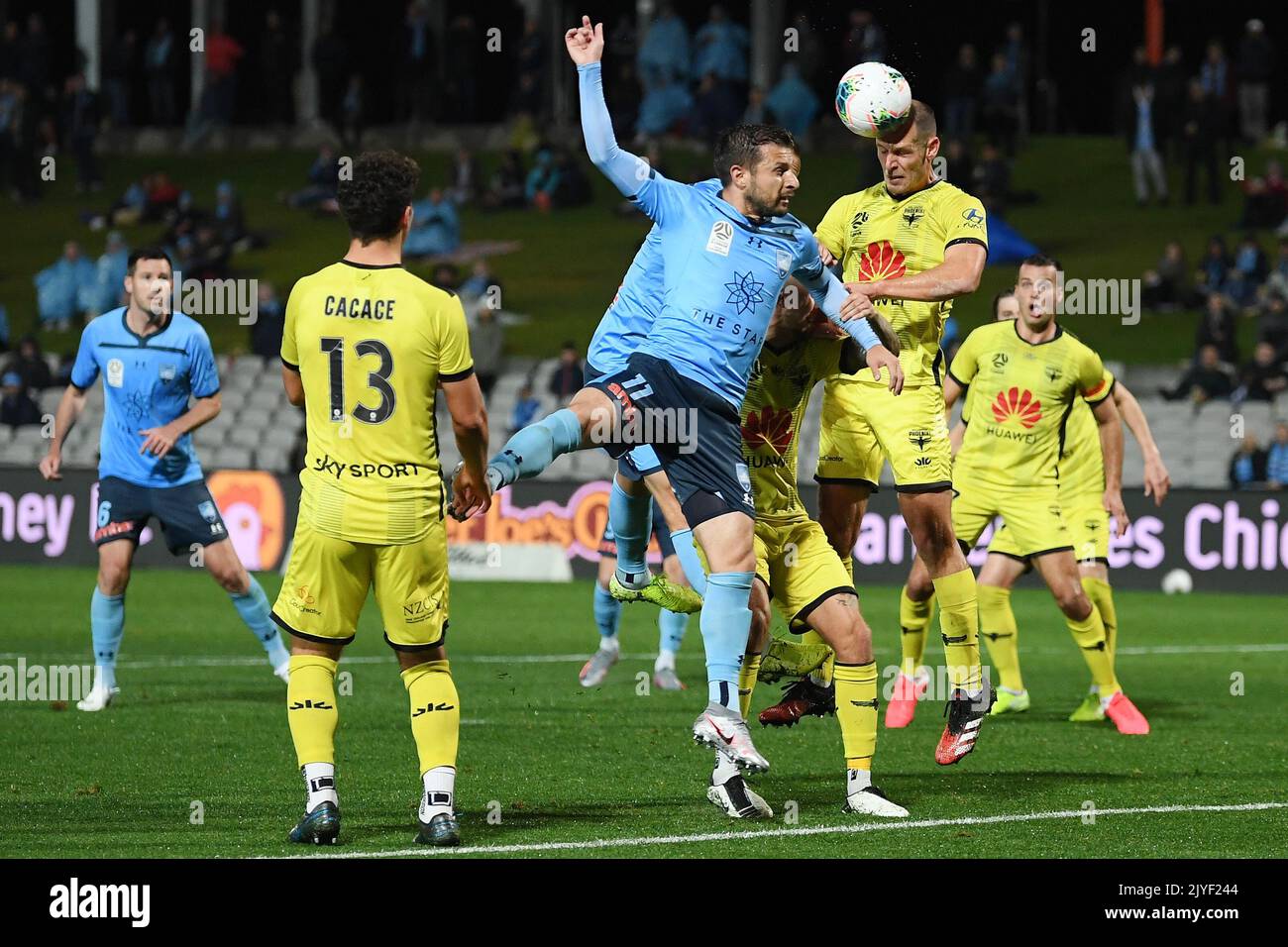 Luke Devere of the Phoenix clears the ball from in front of goal as ...