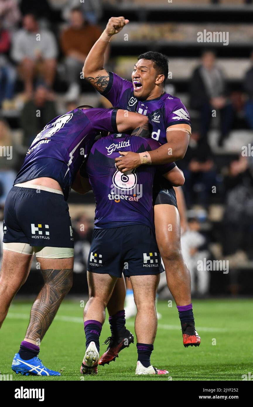 Albert Vete of the Storm celebrates a try by teammate Brandon Smith ...