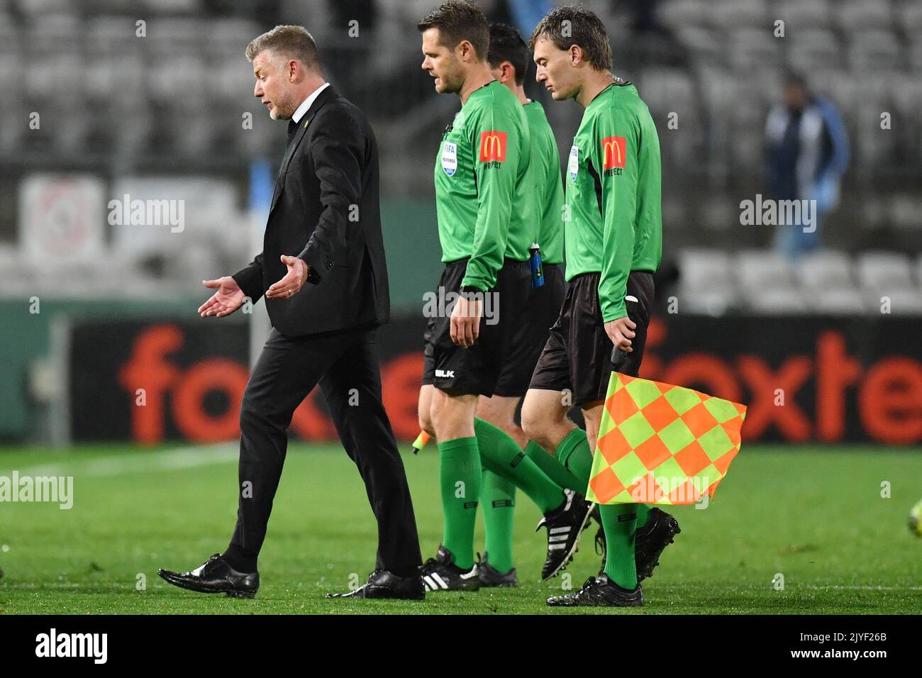 Phoenix coach Ufuk Talay talks to referee Chris Beath and assistant ...