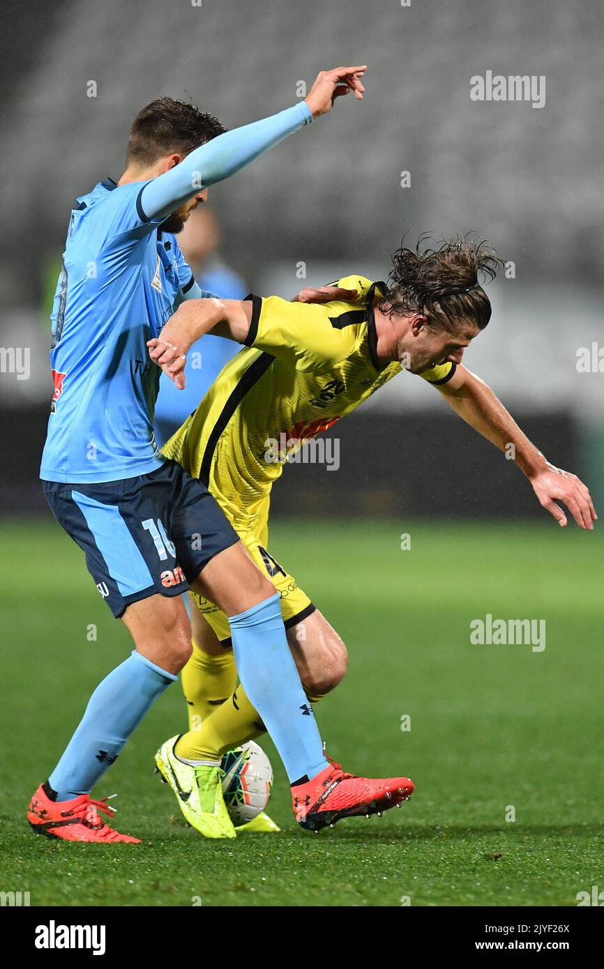 Milos Ninkovic of Sydney and Alex Rufer of the Phoenix during the A ...