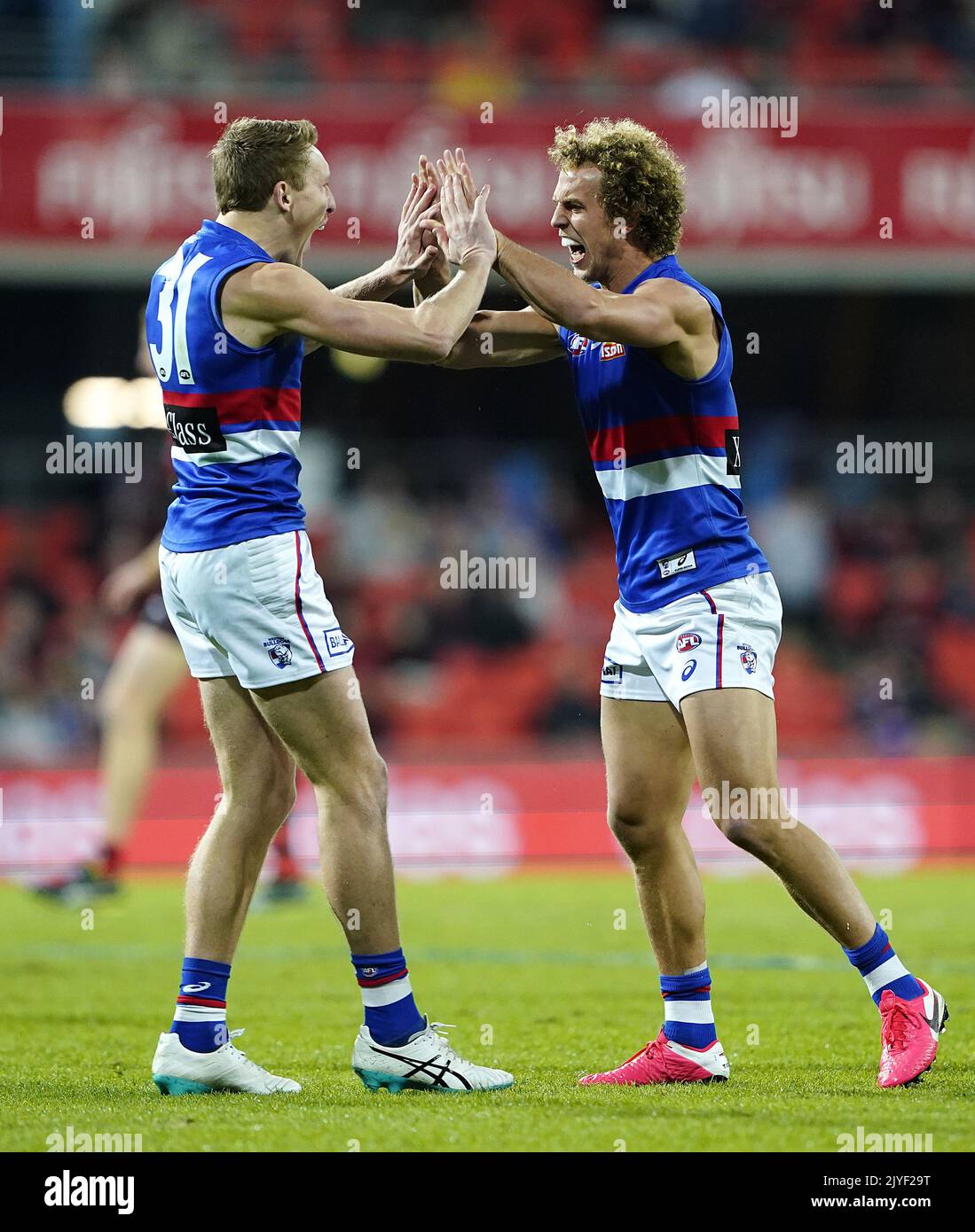 Mitch Wallis of the Bulldogs (right) reacts with Bailey Dale after ...