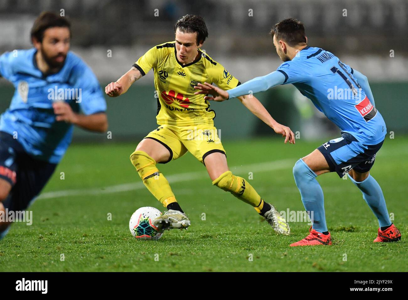 Louis Fenton of the Phoenix and Milos Ninkovic of Sydney during the A ...