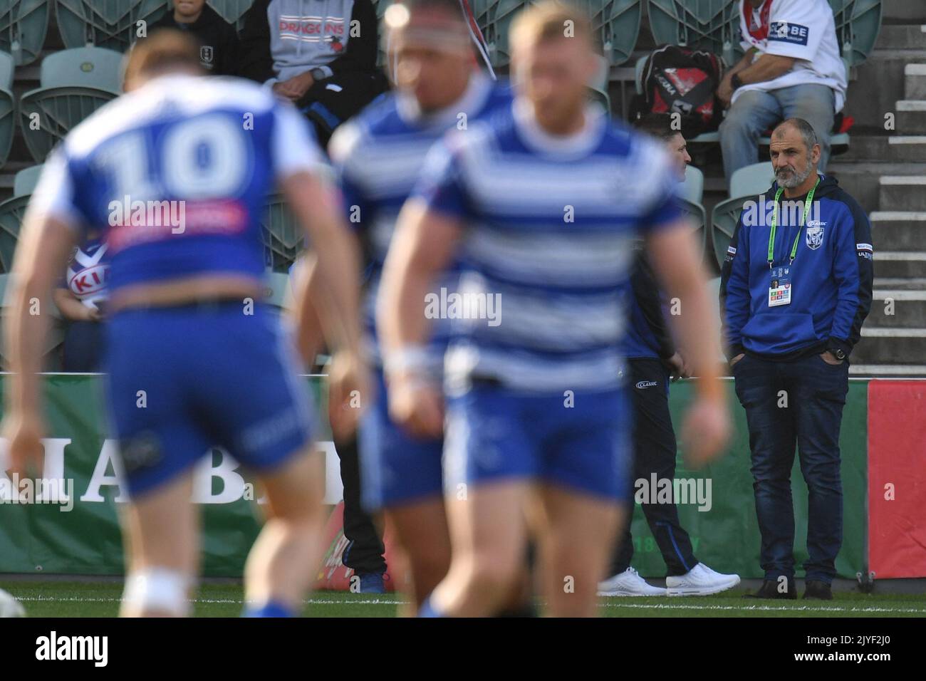 Bulldogs coach Steve Georgallis watches his players warm up ahead of ...