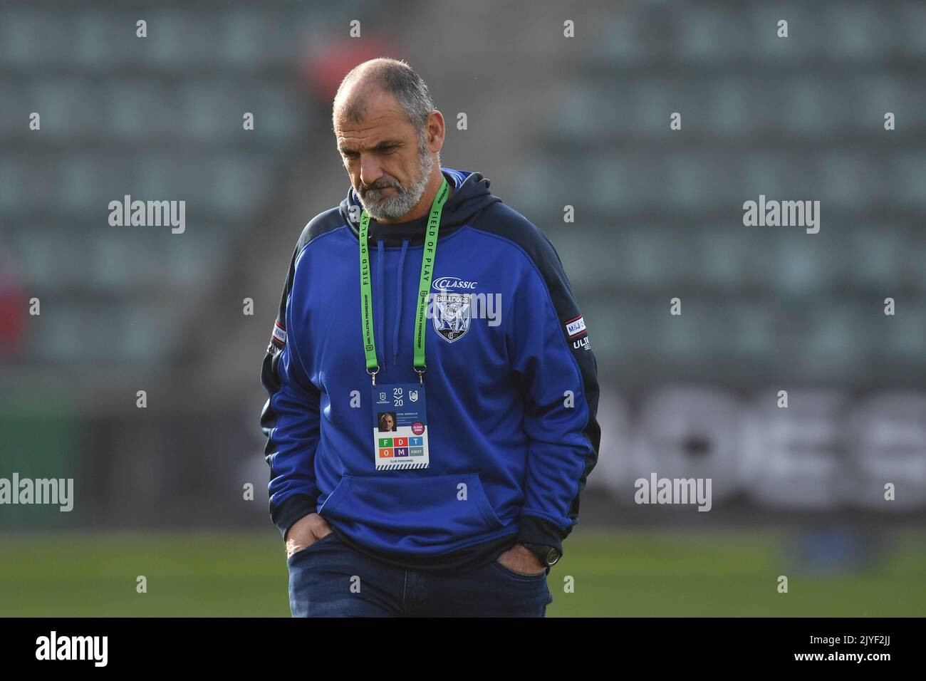 Bulldogs coach Steve Georgallis watches his players warm up ahead of ...