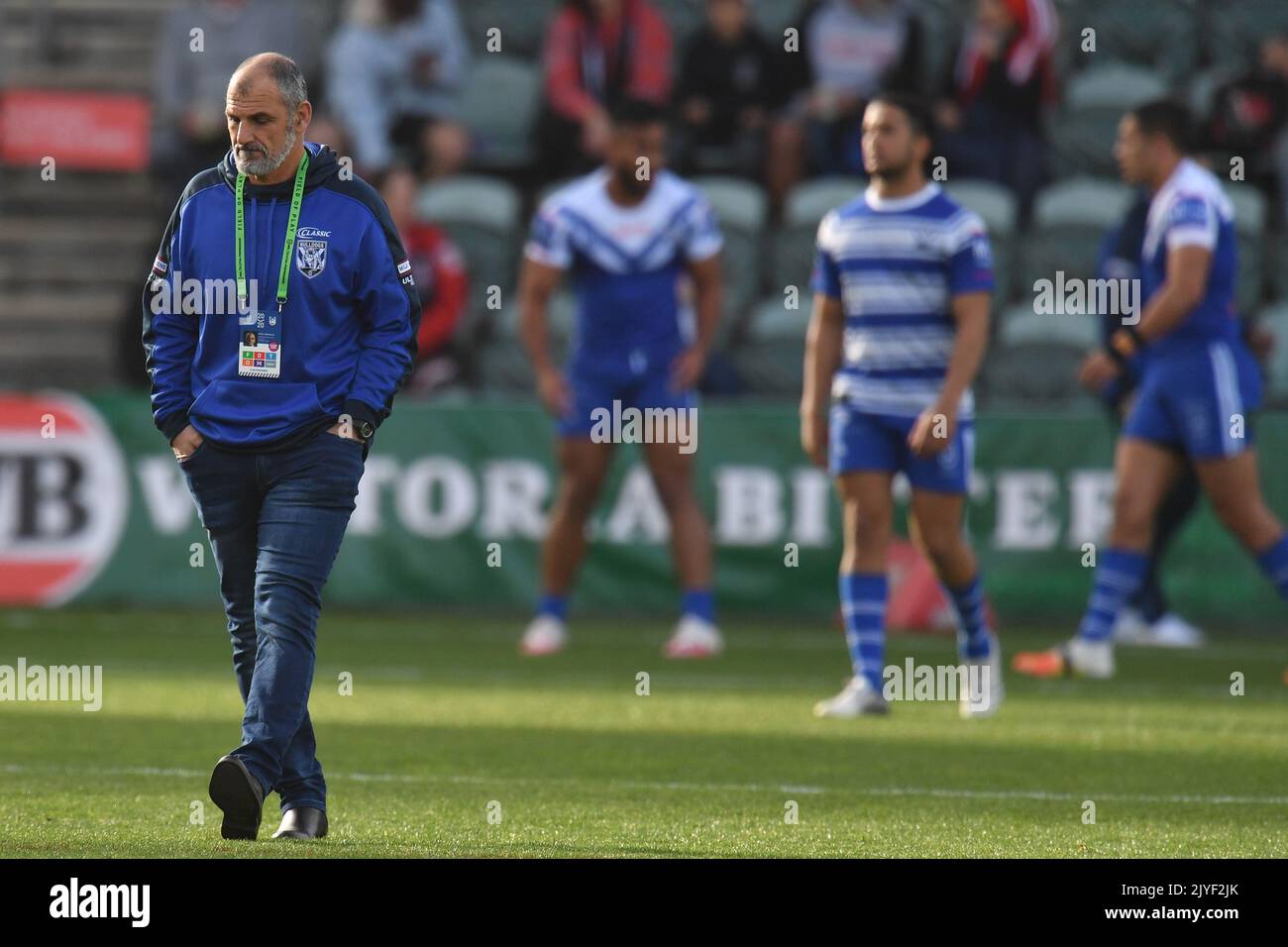 Bulldogs coach Steve Georgallis watches his players warm up ahead of ...
