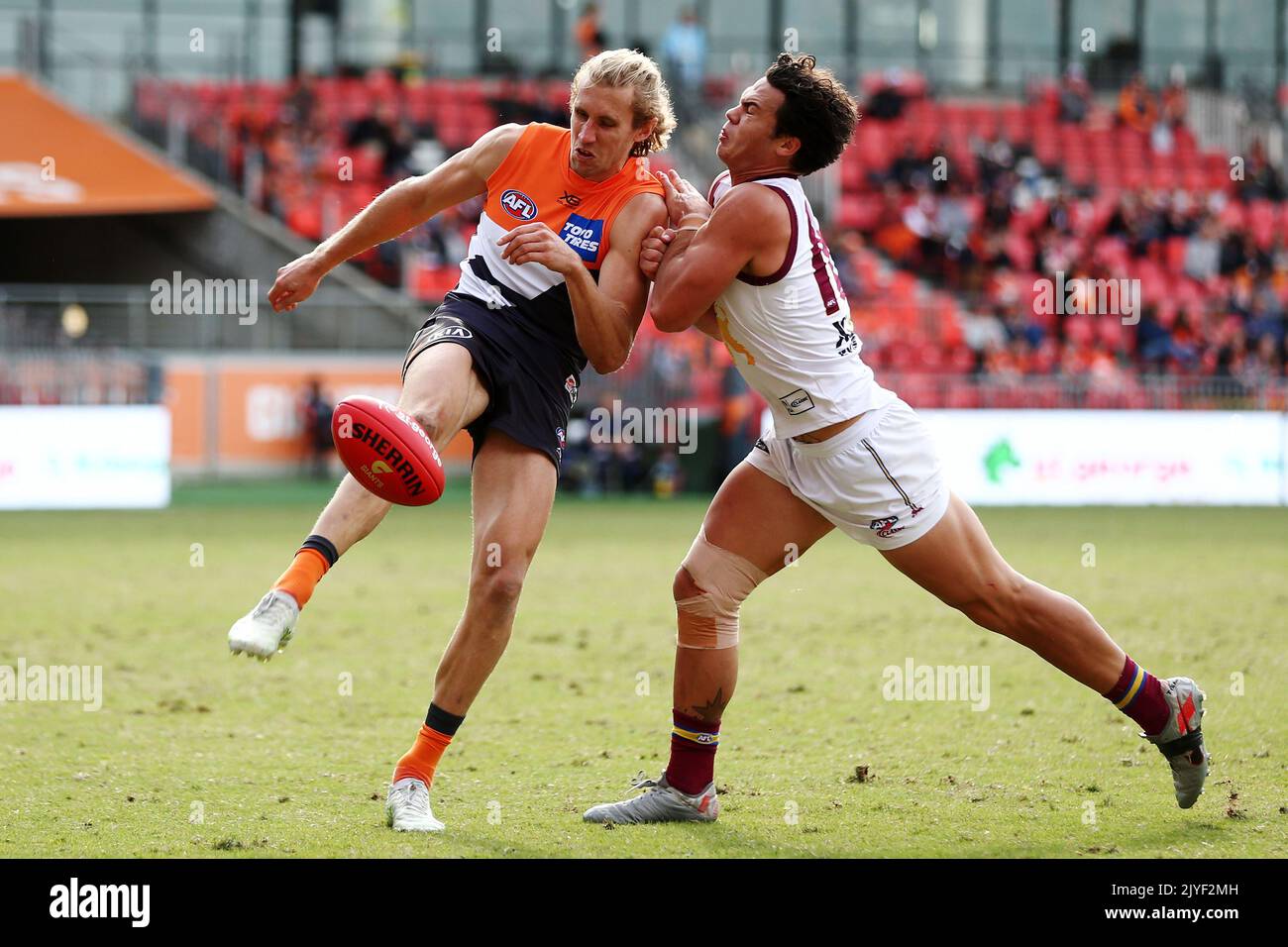 Nick Hayes of the Giants contests the ball with Cam Rayner of the Lions ...