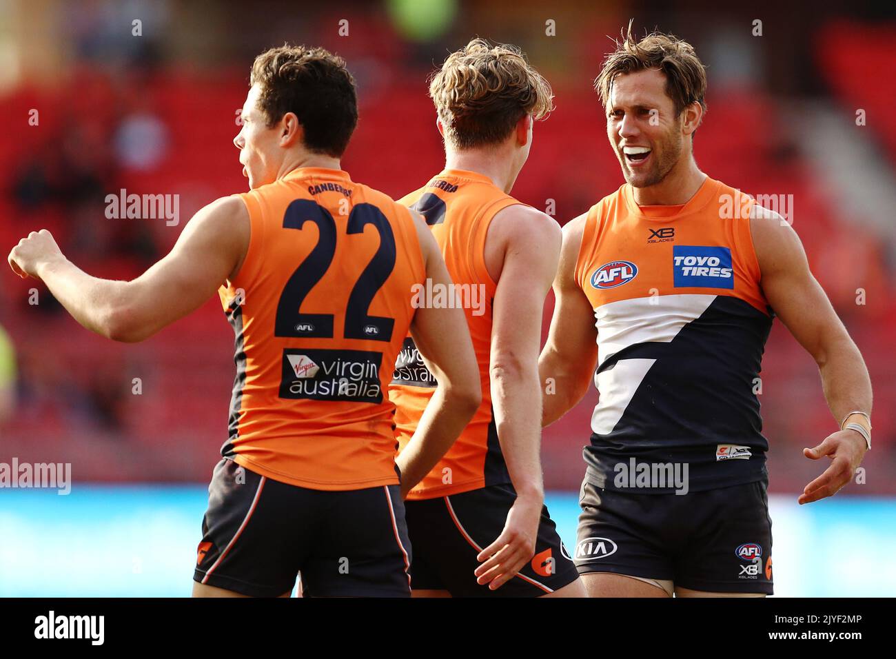 Matt de Boer of the Giants celebrates kicking a goal with team mates ...