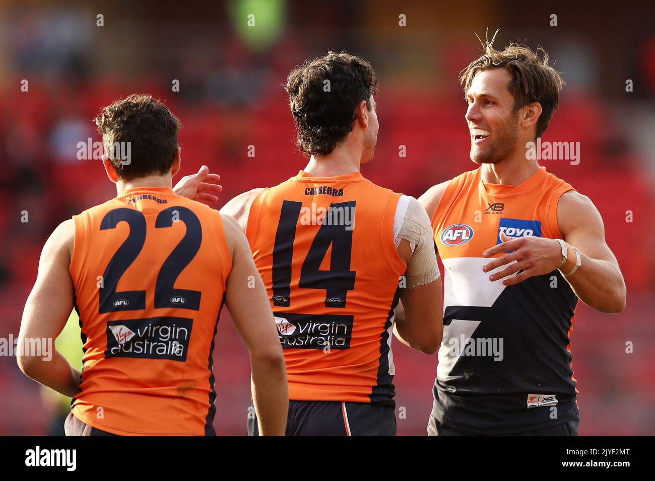 Matt de Boer of the Giants celebrates kicking a goal with team mates ...