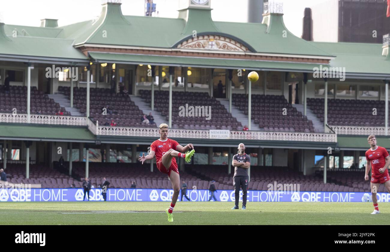 Elijah Taylor of the Swans warms up wearing jumper 37, made famous by ...