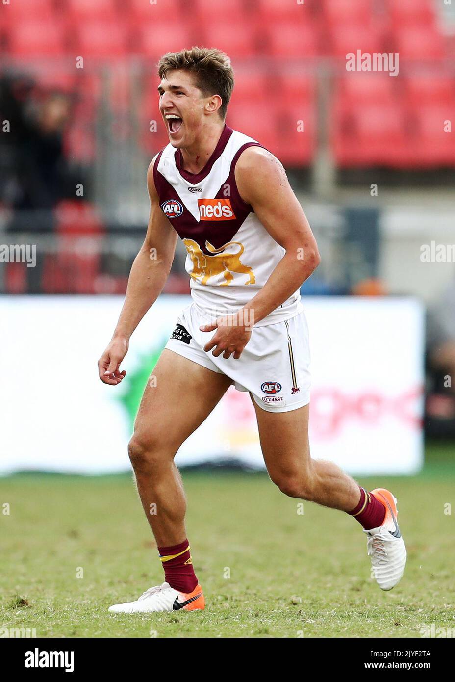 Zac Bailey of the Lions celebrates kicking a goal during the Round 7 ...