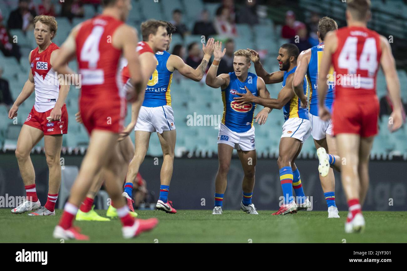Darcy MacPherson of the Suns celebrates after kicking a goal during the ...