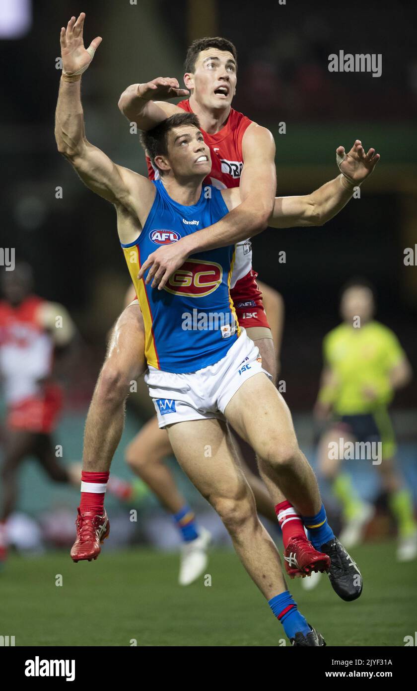 Tom McCartin of the Swans and Sam Collins of the Suns contest a mark ...