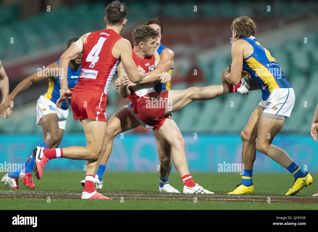 Luke Parker of the Swans tries to get a kick away during the Round 7 ...