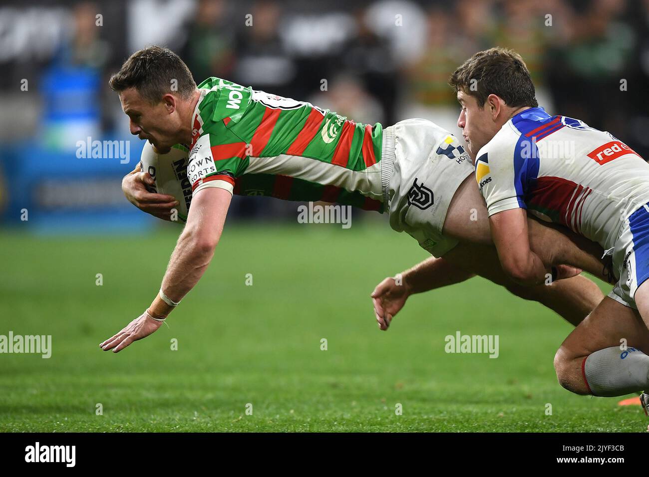 Damien Cook of the Rabbitohs scores a try during the Round 10 NRL match ...