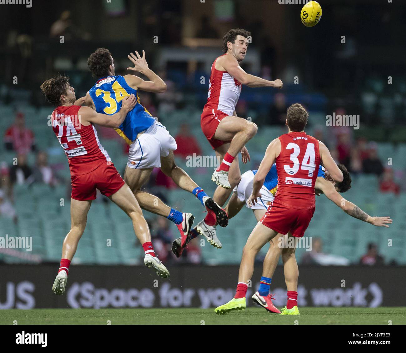 Robbie Fox of the Swans punches the ball away during the Round 7 AFL ...