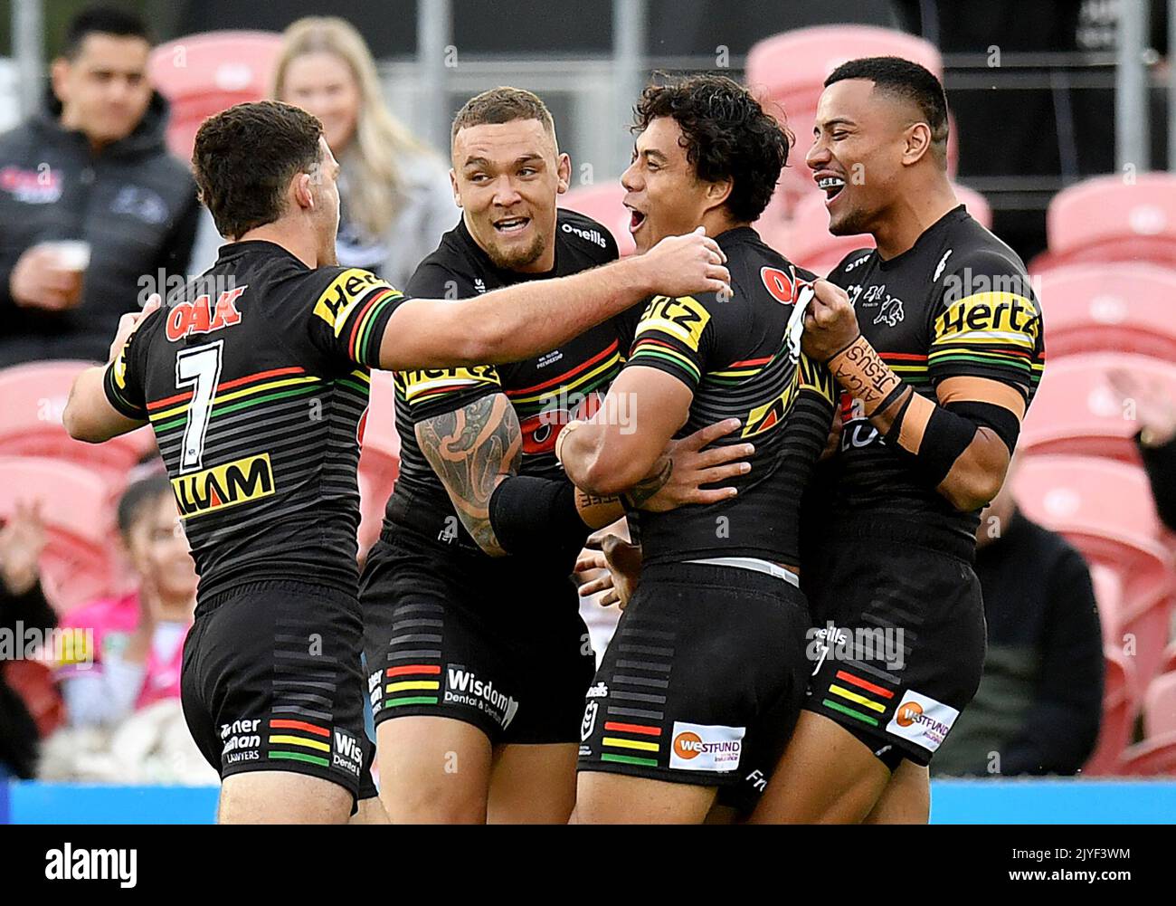 Jerome Luai of the Panthers (2R) celebrates after scoring the opening ...