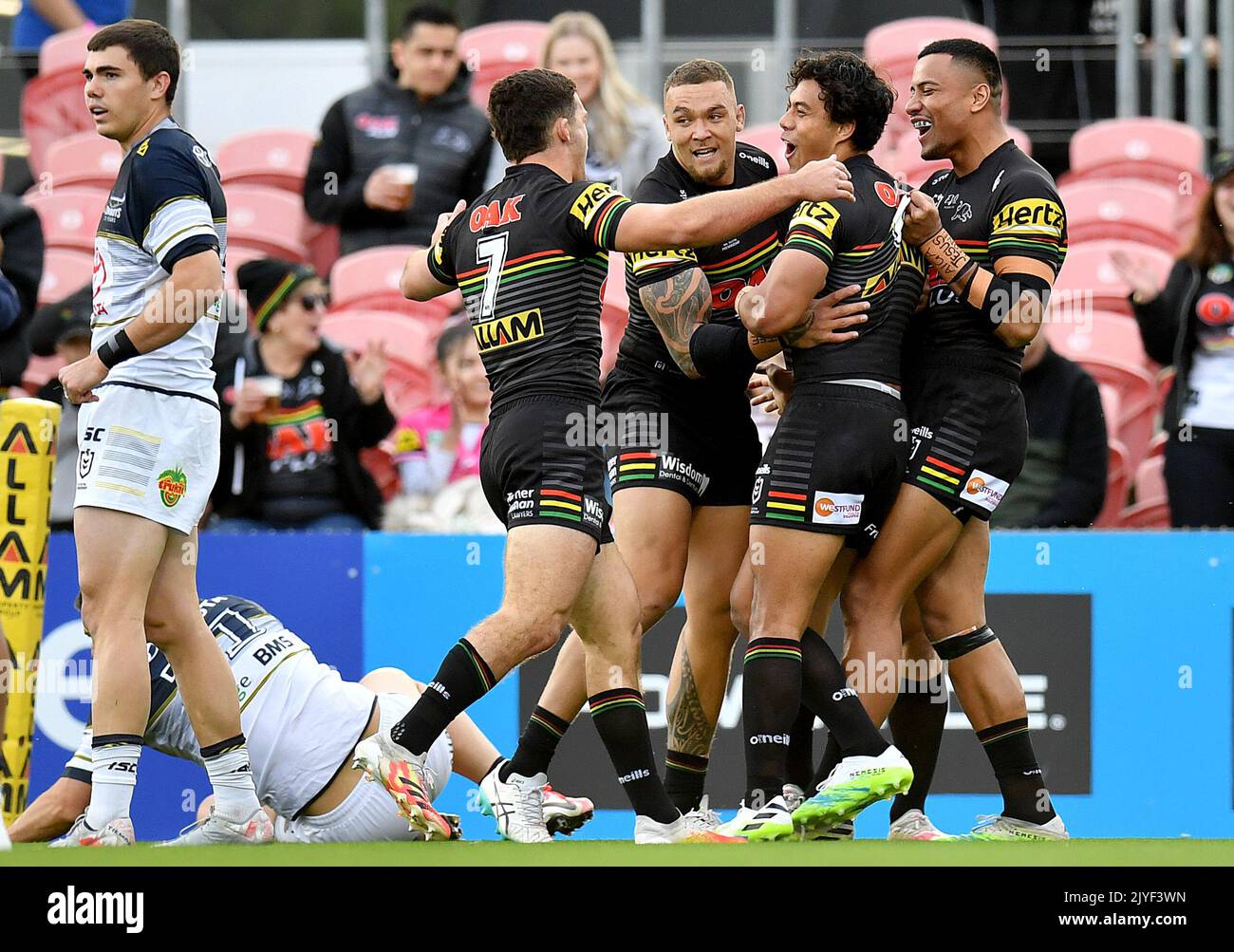Jerome Luai of the Panthers (2R) celebrates after scoring the opening ...