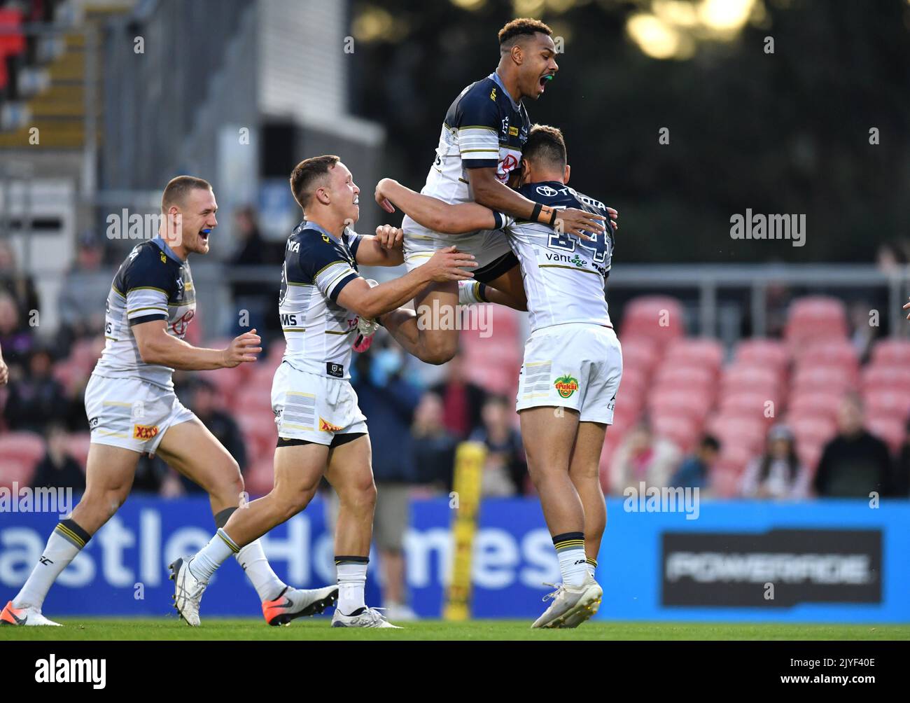 Hamiso Tabuai-Fidow of the Cowboys with try scorer Daejarn Asi (right ...
