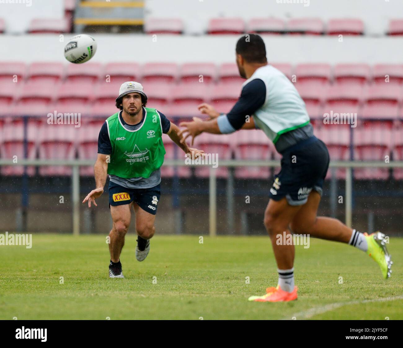 Jake Granville passes to John Asiata during an NRL North Queensland ...