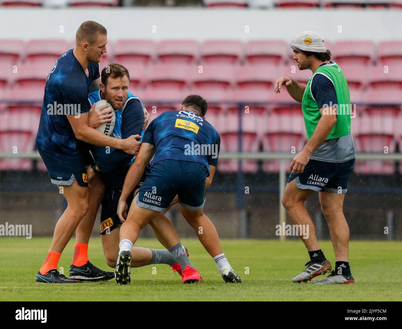 Gavin Cooper is tackled during an NRL North Queensland Cowboys training ...