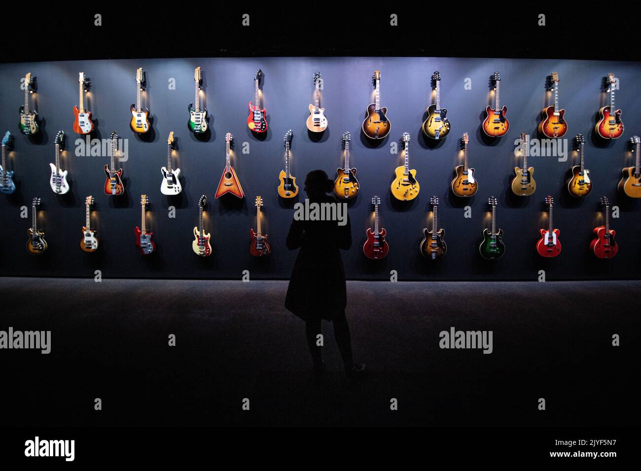 A person admires a wall of Maton Guitars during a media preview of the ...