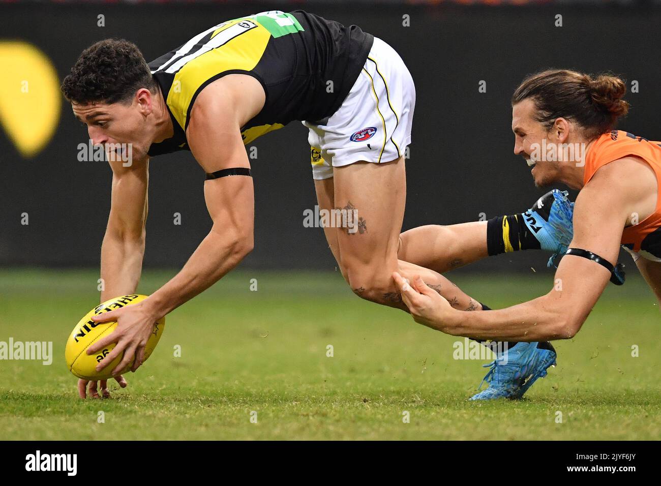 Jason Castagna of the Tigers and Phil Davis of the Giants during the ...