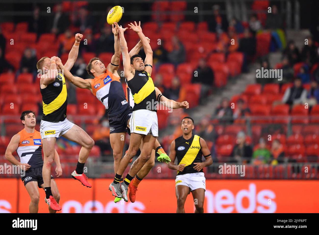 Marlion Pickett of the Tigers and Zac Langdon of the Giants compete ...
