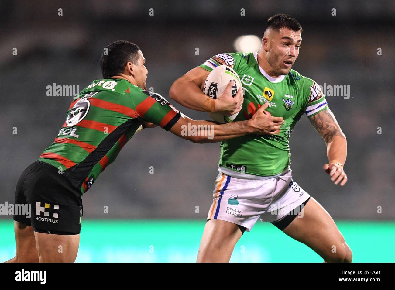 Adam Reynolds of the Rabbitohs celebrates with team mates after scoring ...