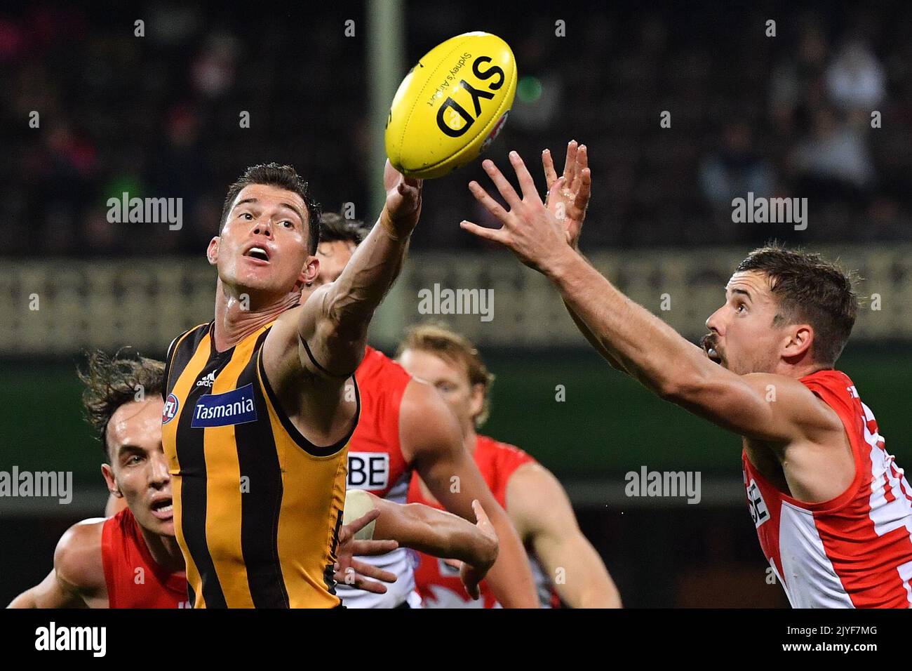 Jaeger O'Meara of the Hawks and Jake Lloyd of the Swans during the ...
