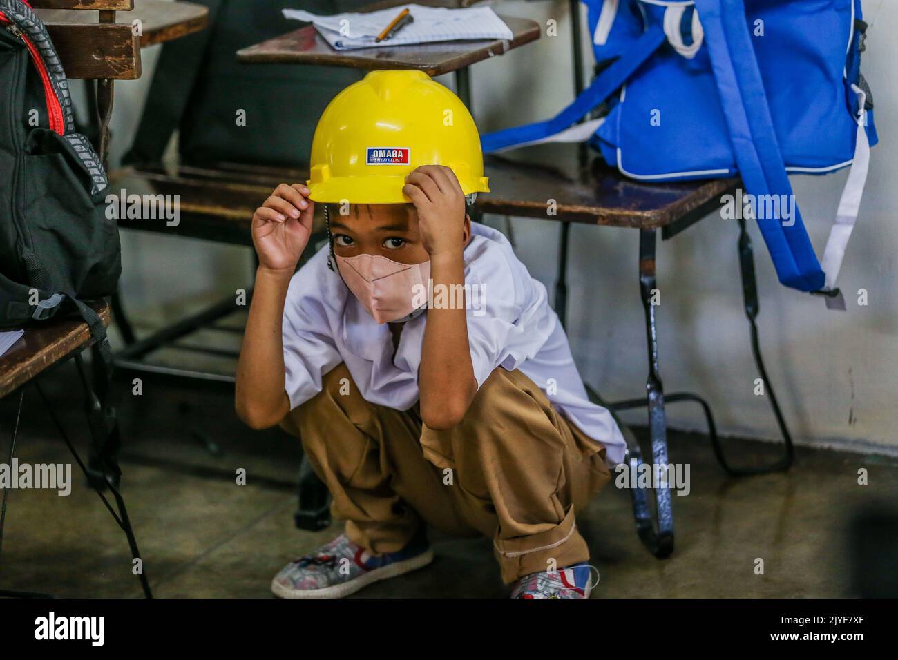 Manila, Philippines. 8th Sep, 2022. A student wearing a hard hat ...