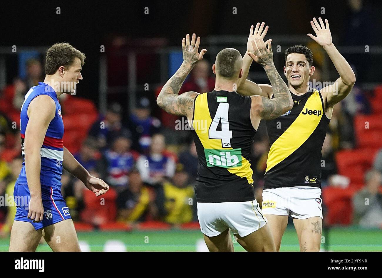 Jason Castagna of the Tigers (right) reacts with Dustin Martin after ...