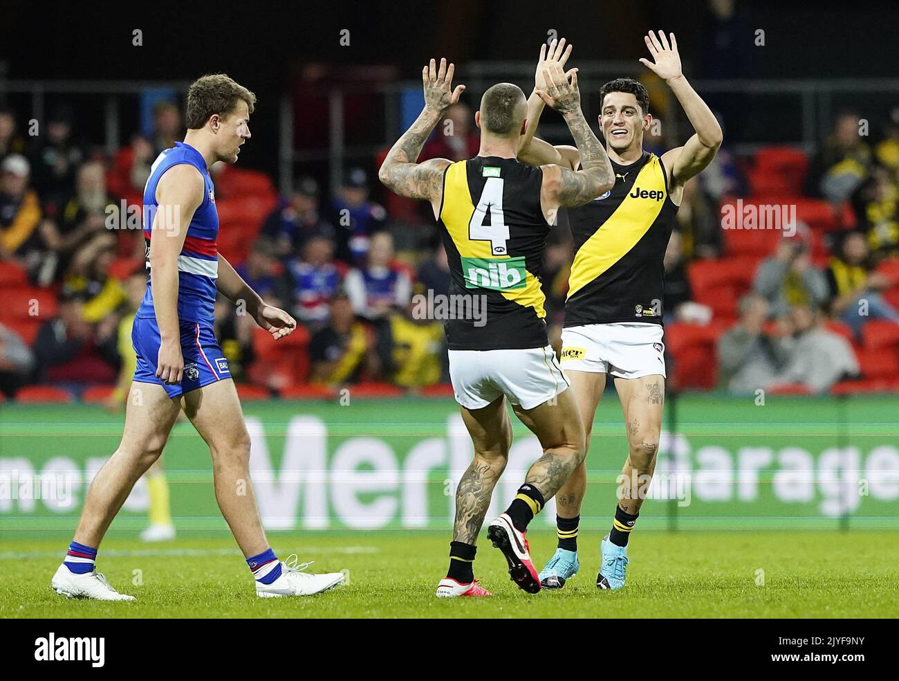Jason Castagna of the Tigers (right) reacts with Dustin Martin after ...