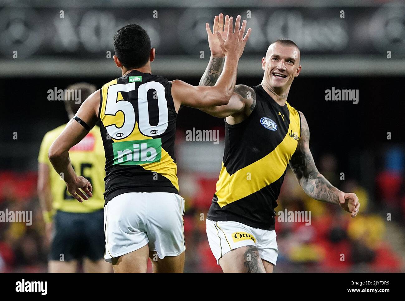 Dustin Martin of the Tigers (right) reacts with Marlion Pickett after ...