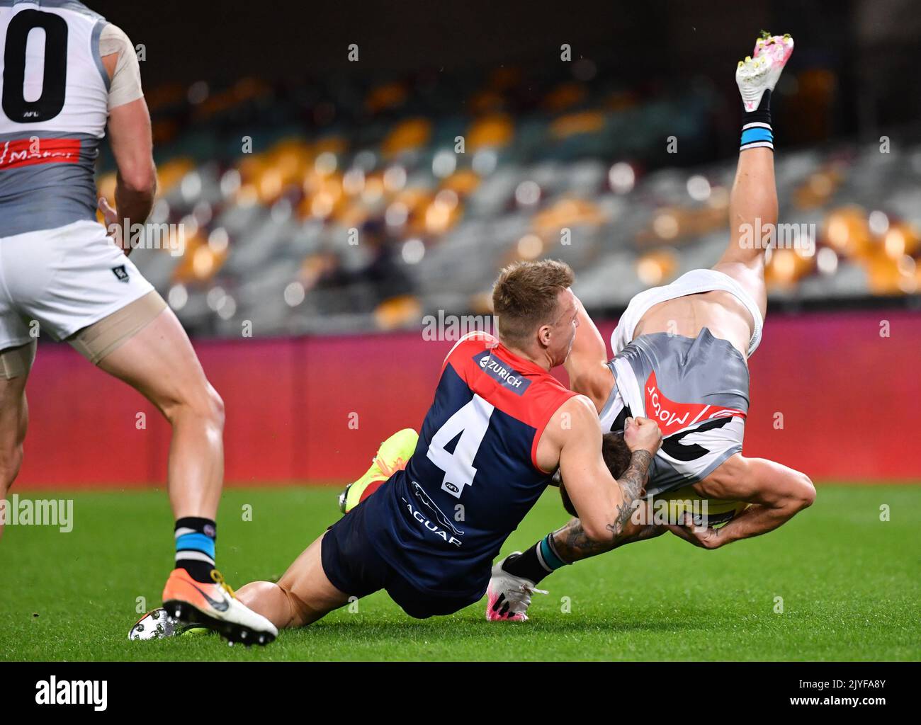 James Harmes (left) of the Demons tackles Kane Farrell (right) of the ...