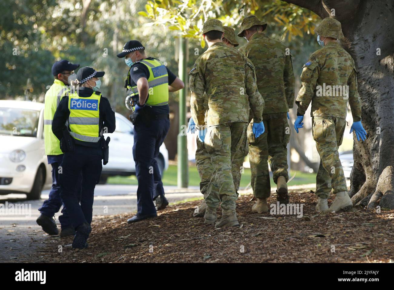 Police and ADF are seen at the Botanic Gardens in Melbourne, Friday ...