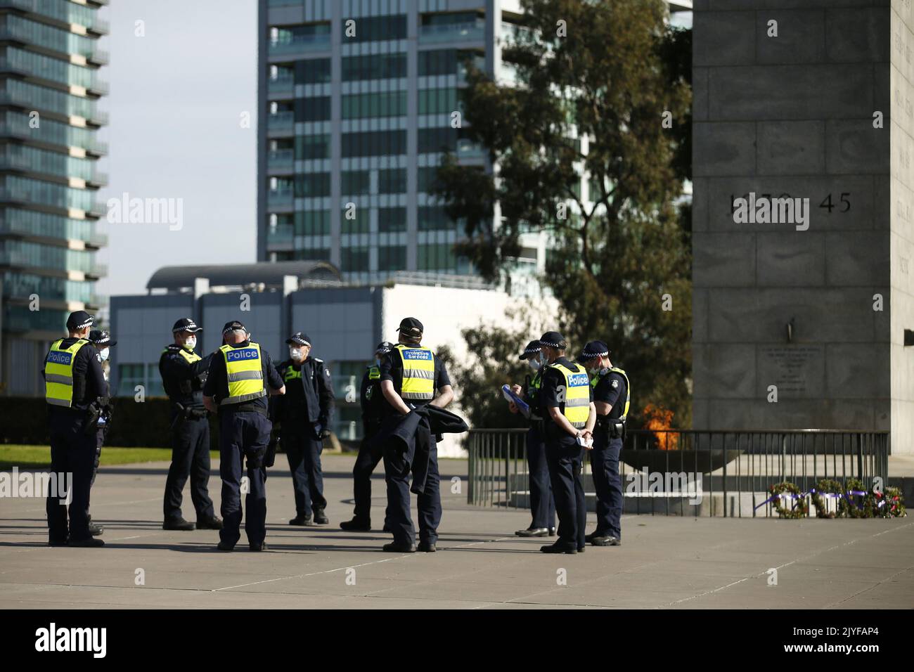 Police are seen at the Shrine of Remembrance in Melbourne, Friday, July ...