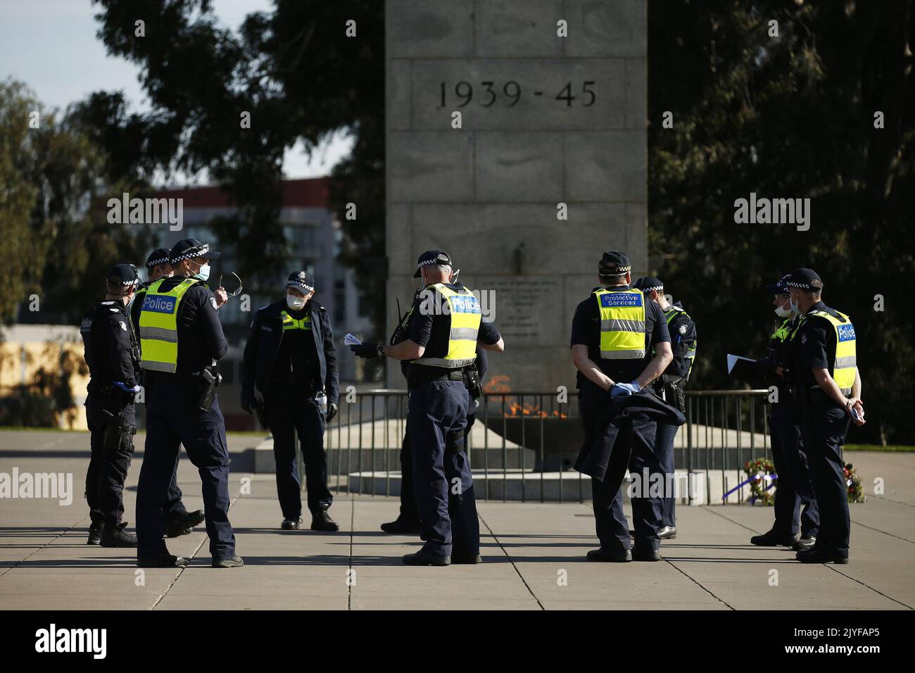 Police are seen at the Shrine of Remembrance in Melbourne, Friday, July ...