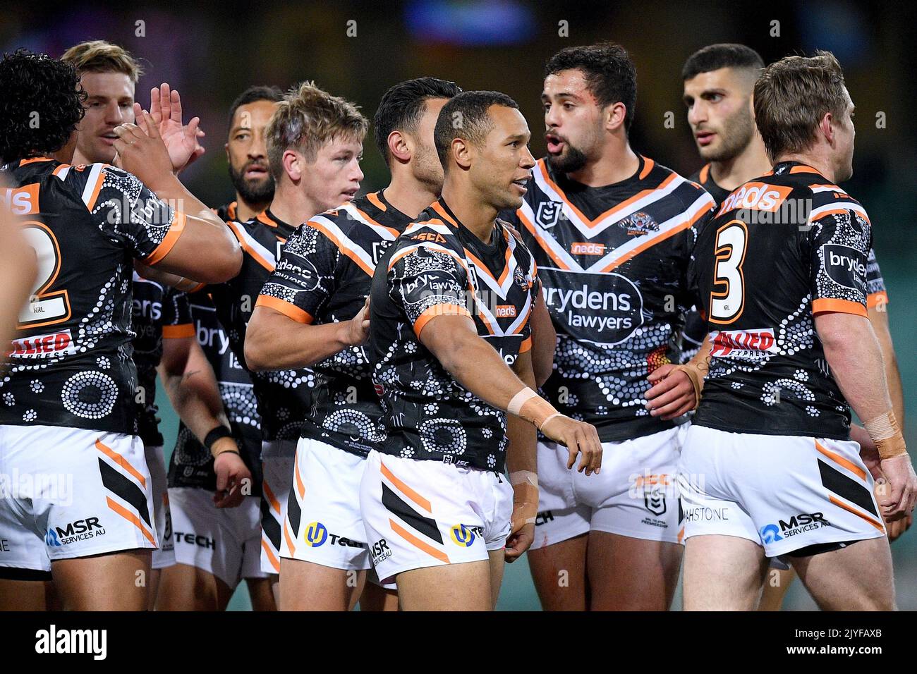 Moses Mbye of the Tigers (centre) celebrates with teammates after ...